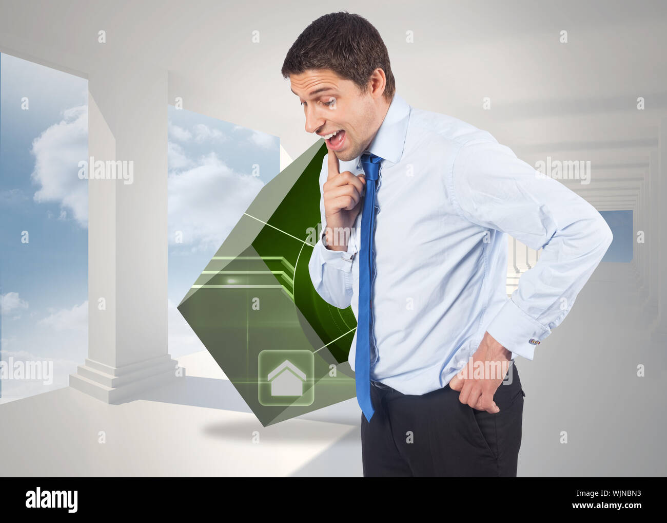 Thinking businessman touching his chin against bright white hall with ...