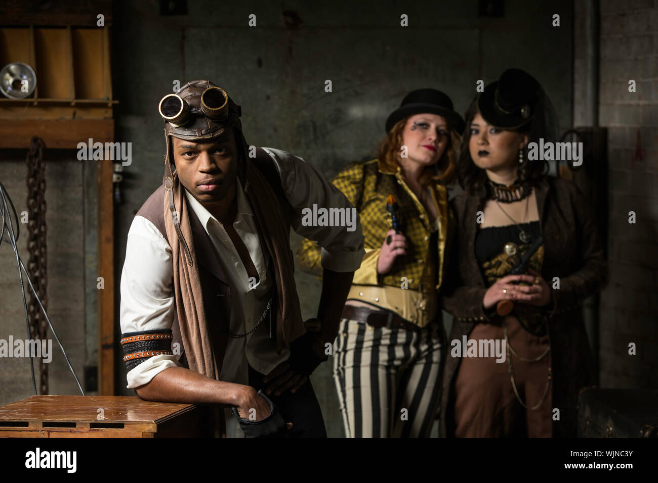 Young Steam Punks PosIng in Underground Lair Stock Photo - Alamy