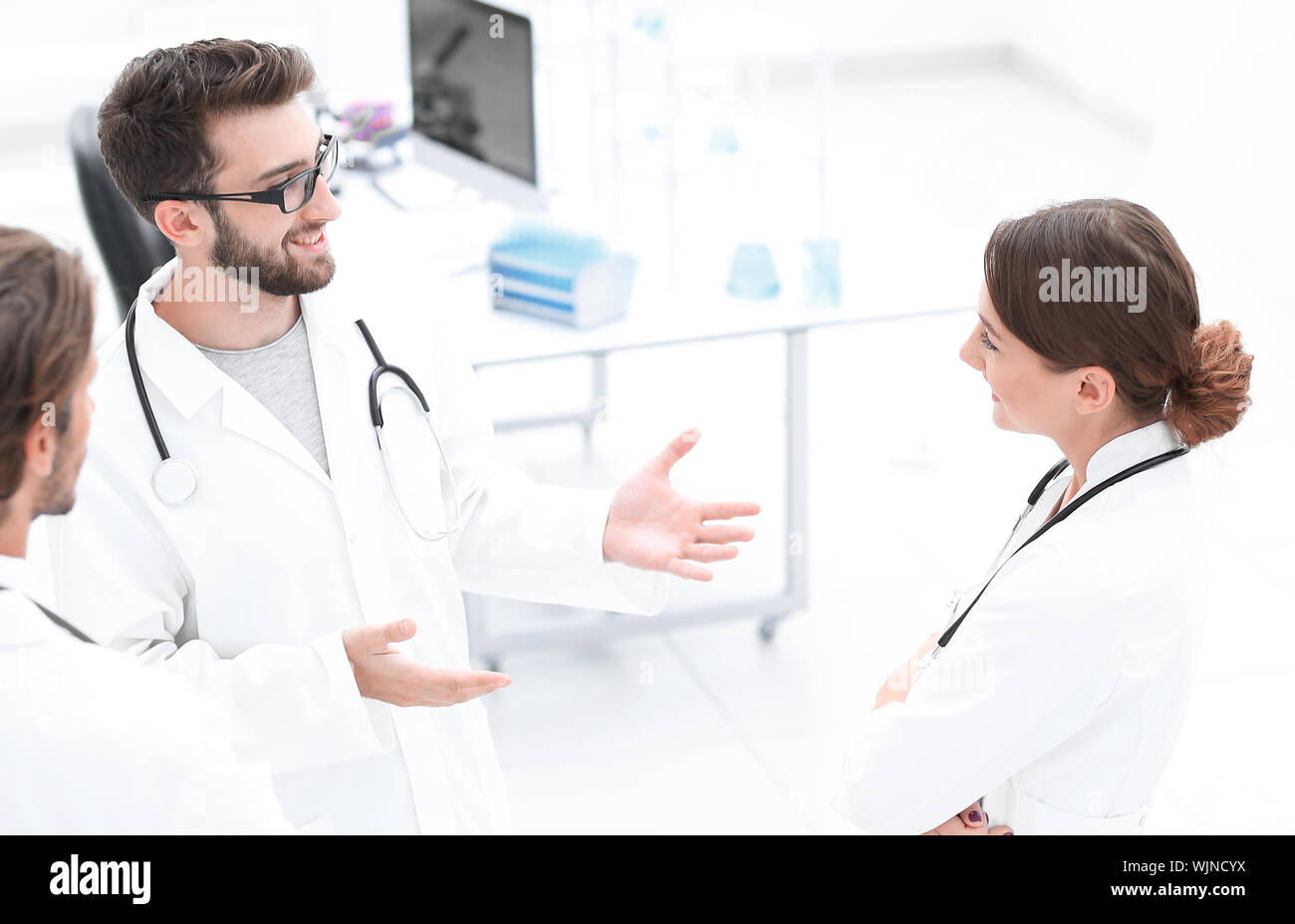 Group of doctors talking Stock Photo - Alamy