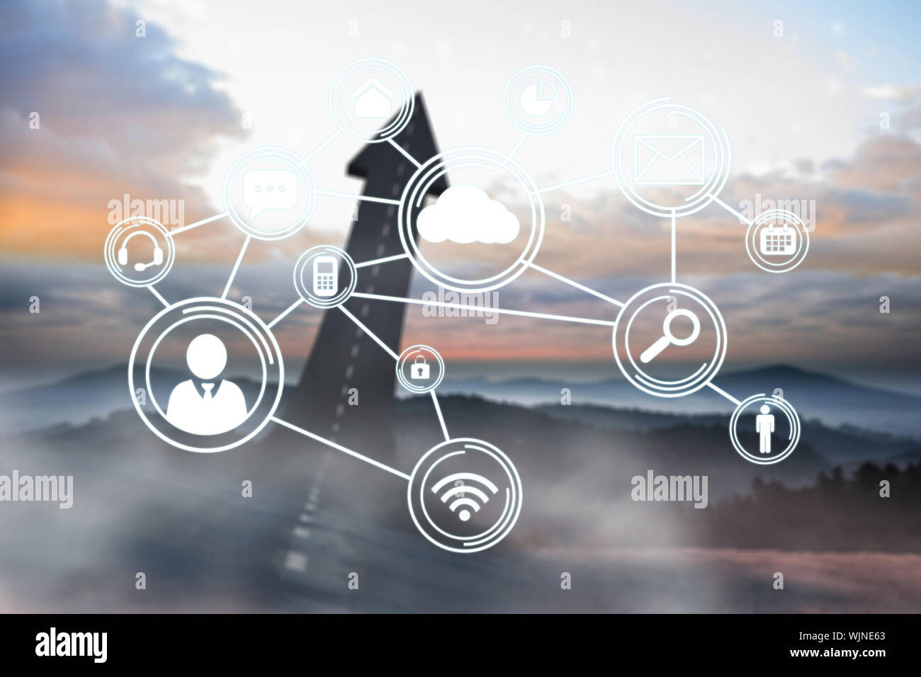 Technology interface against road turning into arrow Stock Photo - Alamy