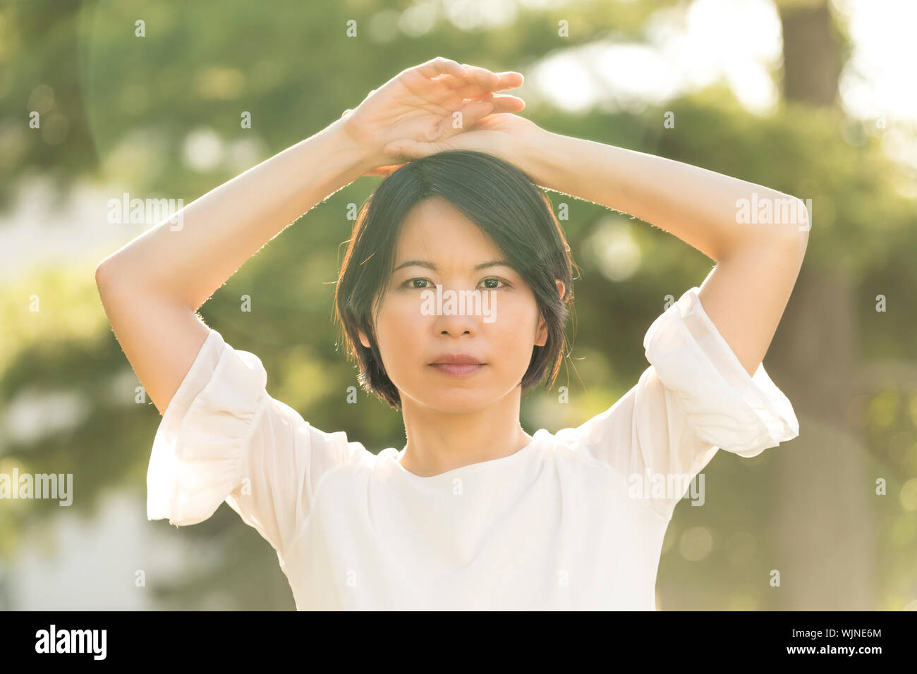 Portrait young woman outdoor back light Stock Photo - Alamy