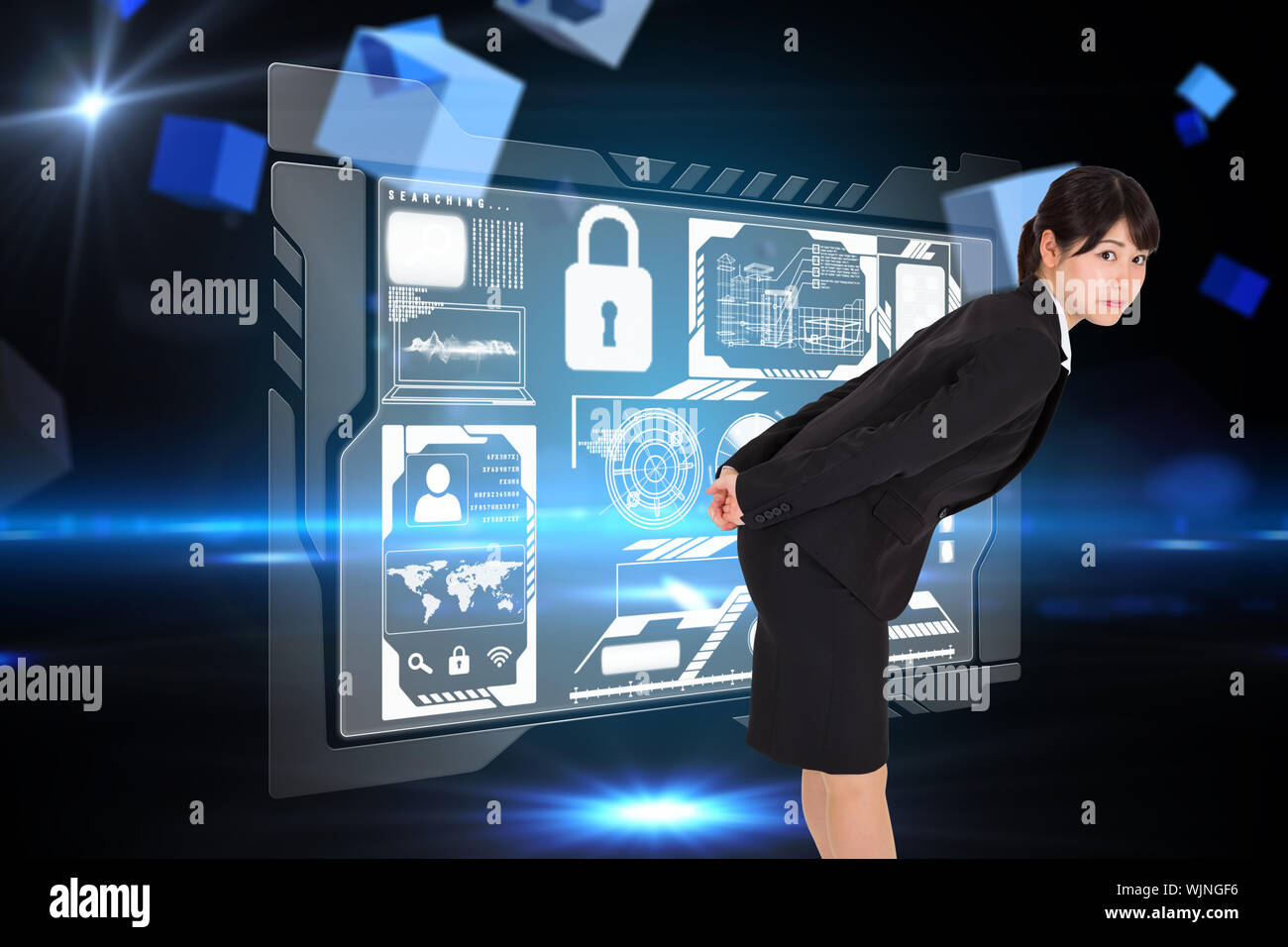 Serious businesswoman bending against boxes on technical background ...