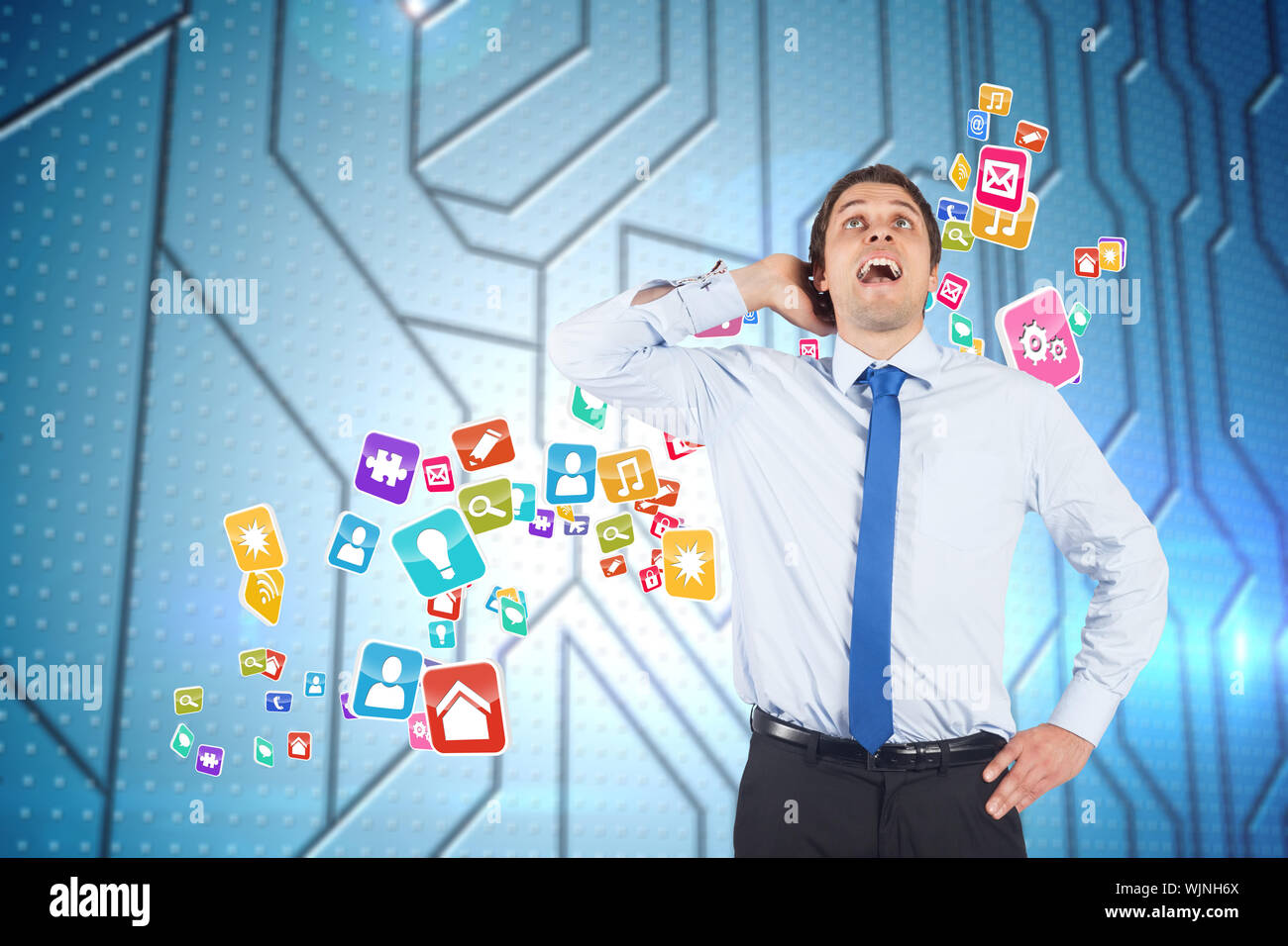 Thinking businessman scratching head against circuit board on ...