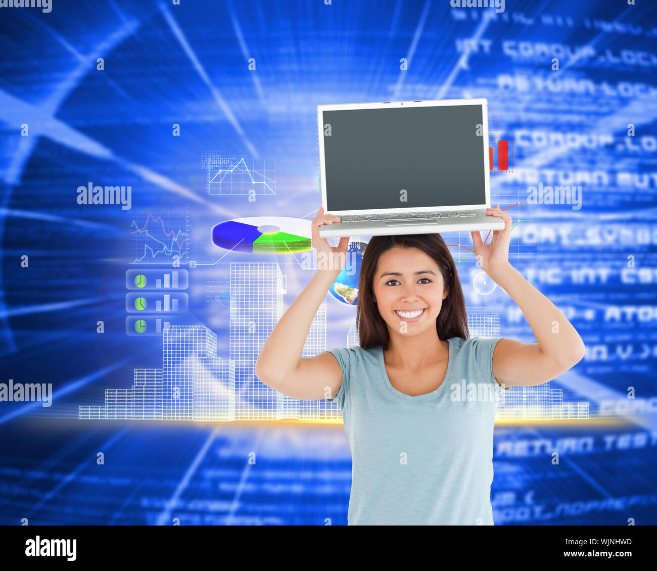 Gorgeous woman posing with her laptop against blue background with ...