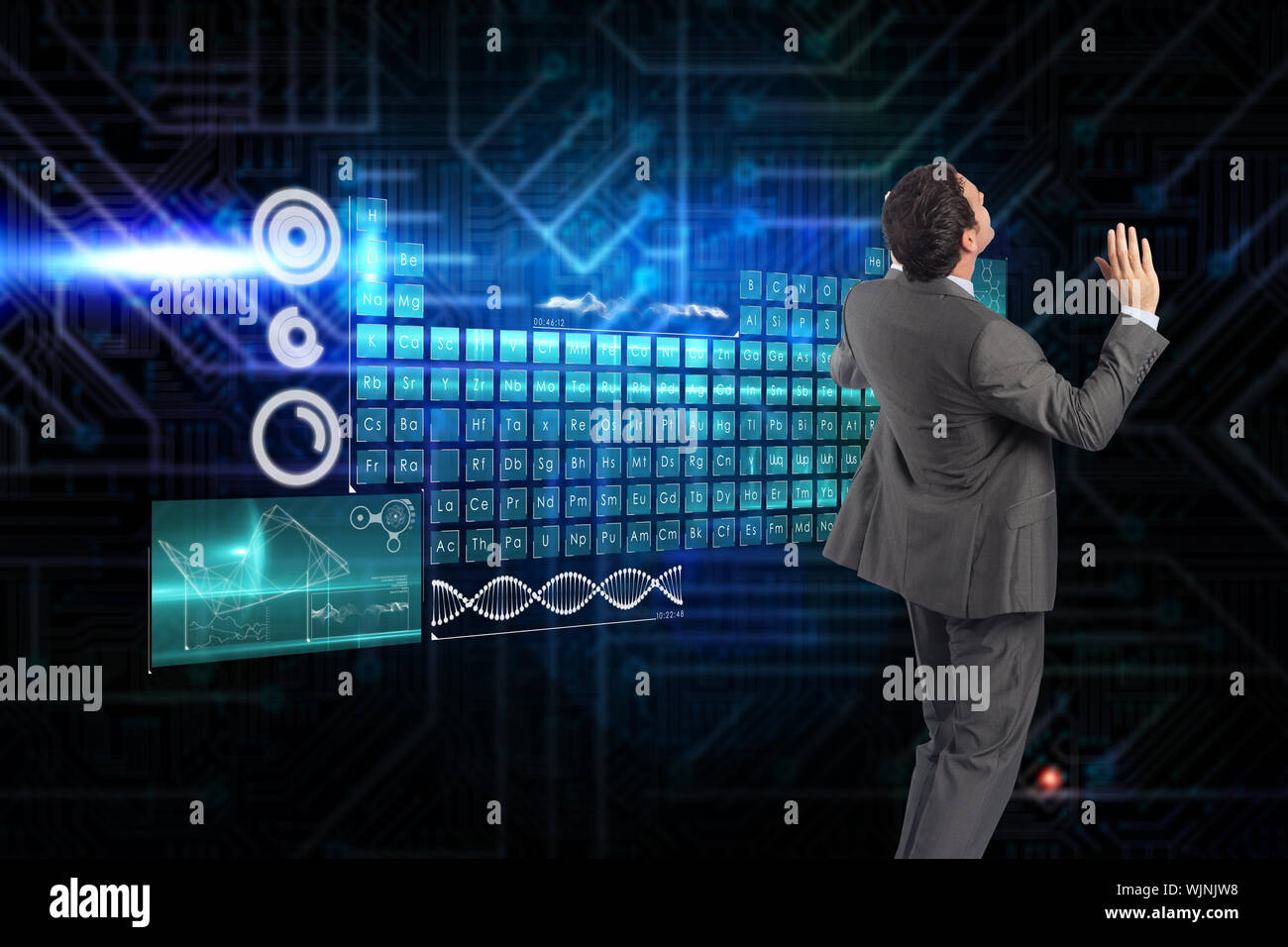 Businessman posing with arms raised against futuristic black and blue ...