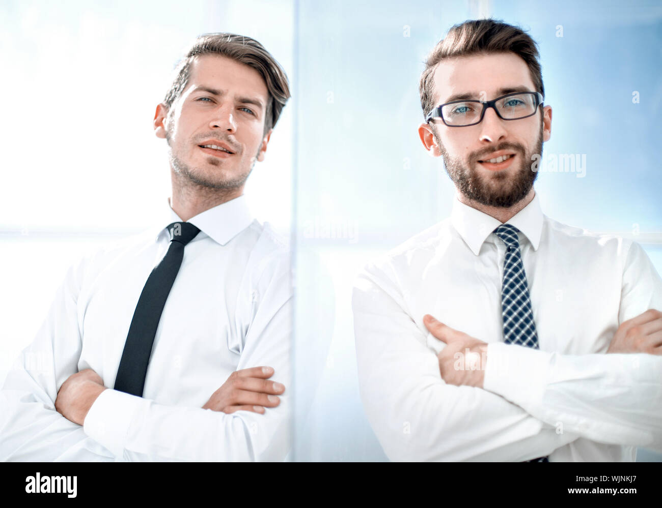 smiling business colleagues standing in a bright office Stock Photo - Alamy