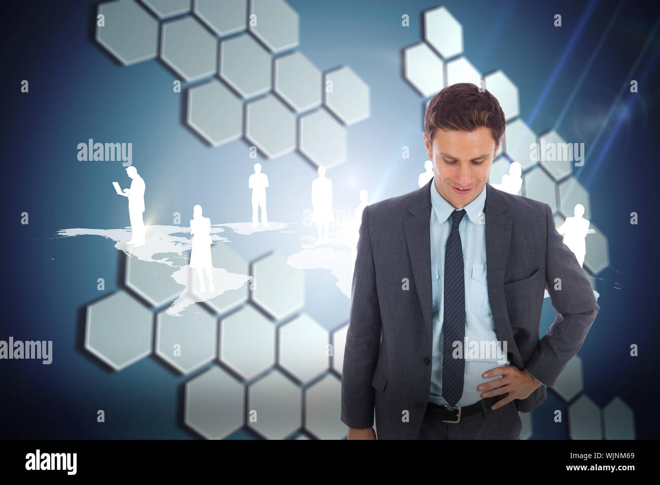 Cheerful businessman standing with hand on hip against technological background with hexagons ...