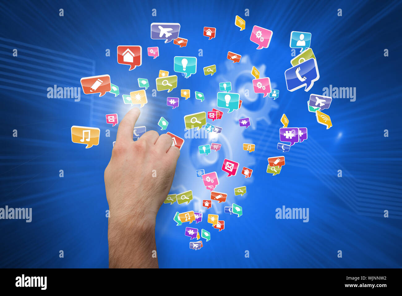 Hand presenting against shiny cogs on blue background Stock Photo - Alamy