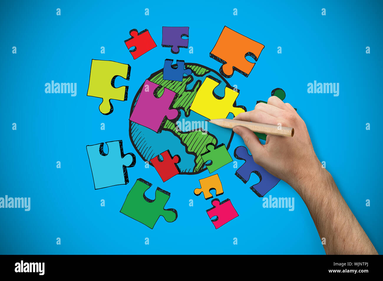 Hand holding a pencil against blue background with vignette Stock Photo ...