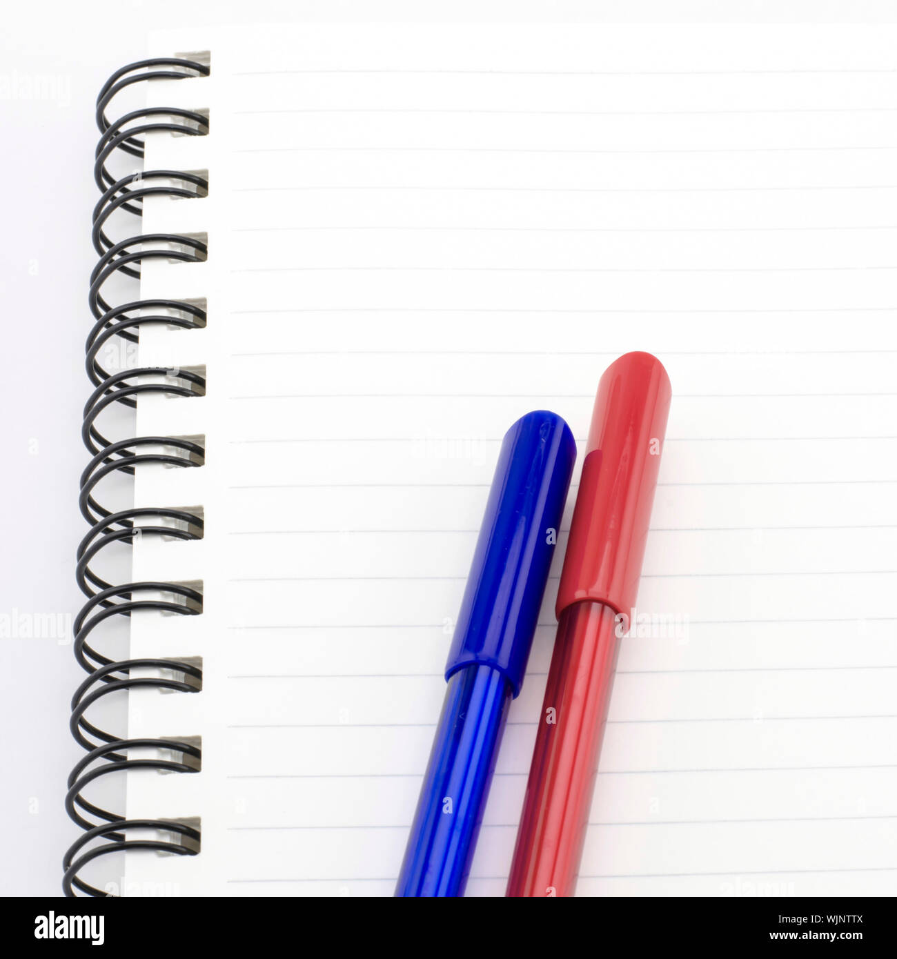 blue and red pen with notebook isolated on white background Stock Photo ...