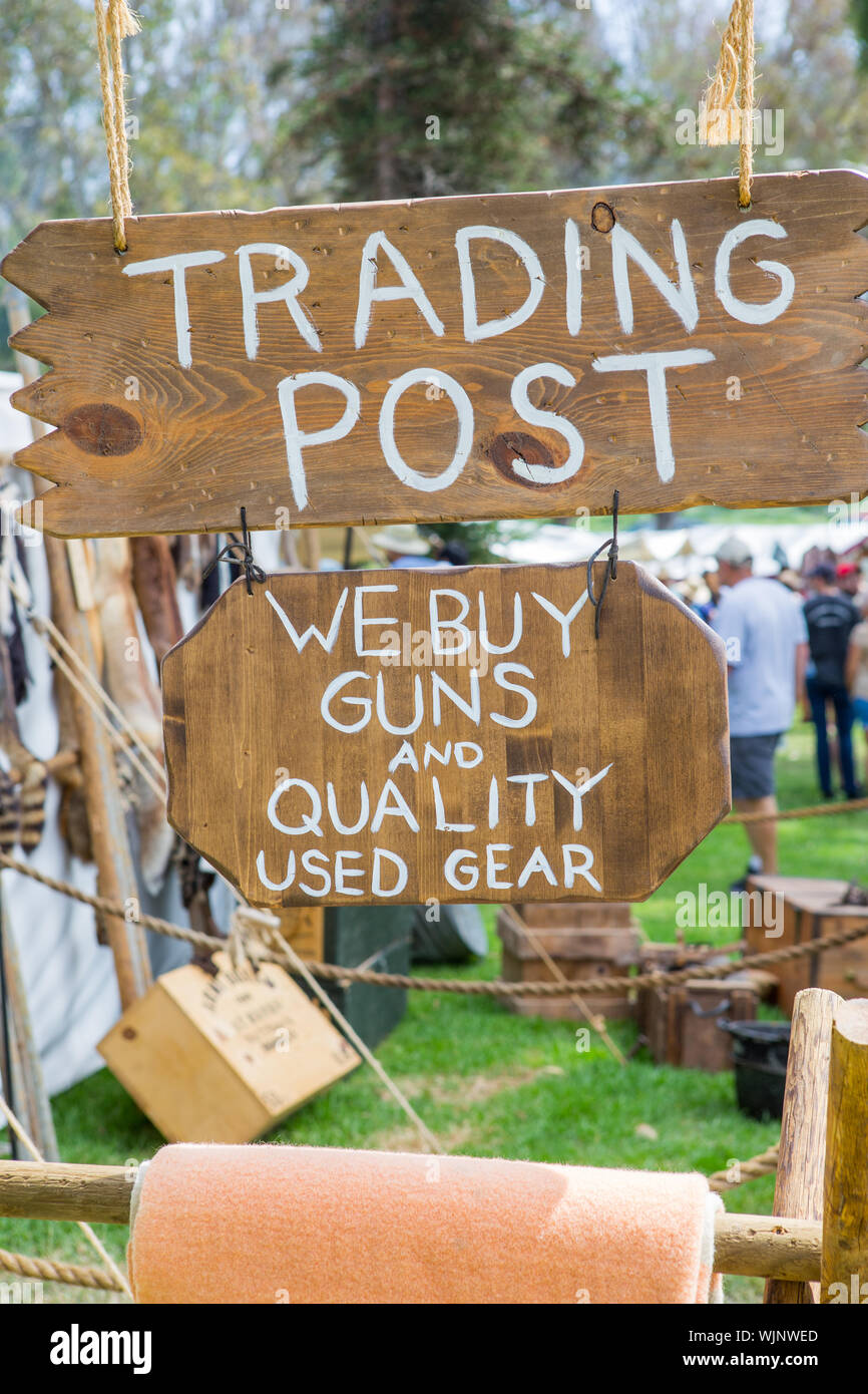 Wood trading post sign outside a store at a American revolution ...