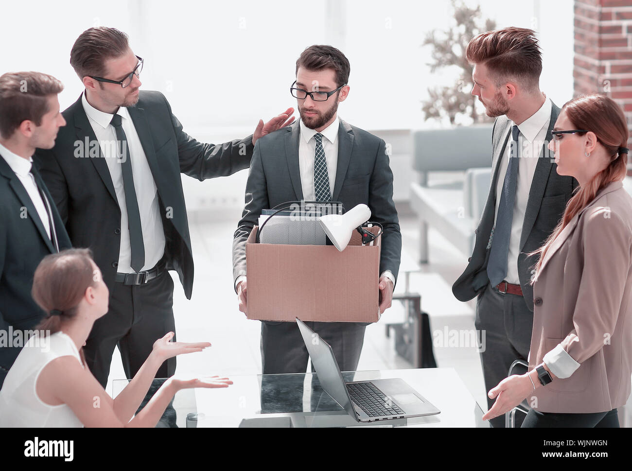 business team and frustrated employee with personal things Stock Photo ...