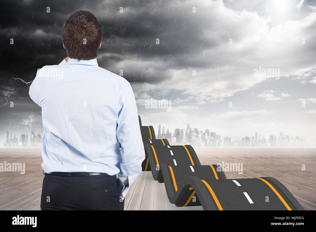 Bumpy road leading to city Stock Photo - Alamy