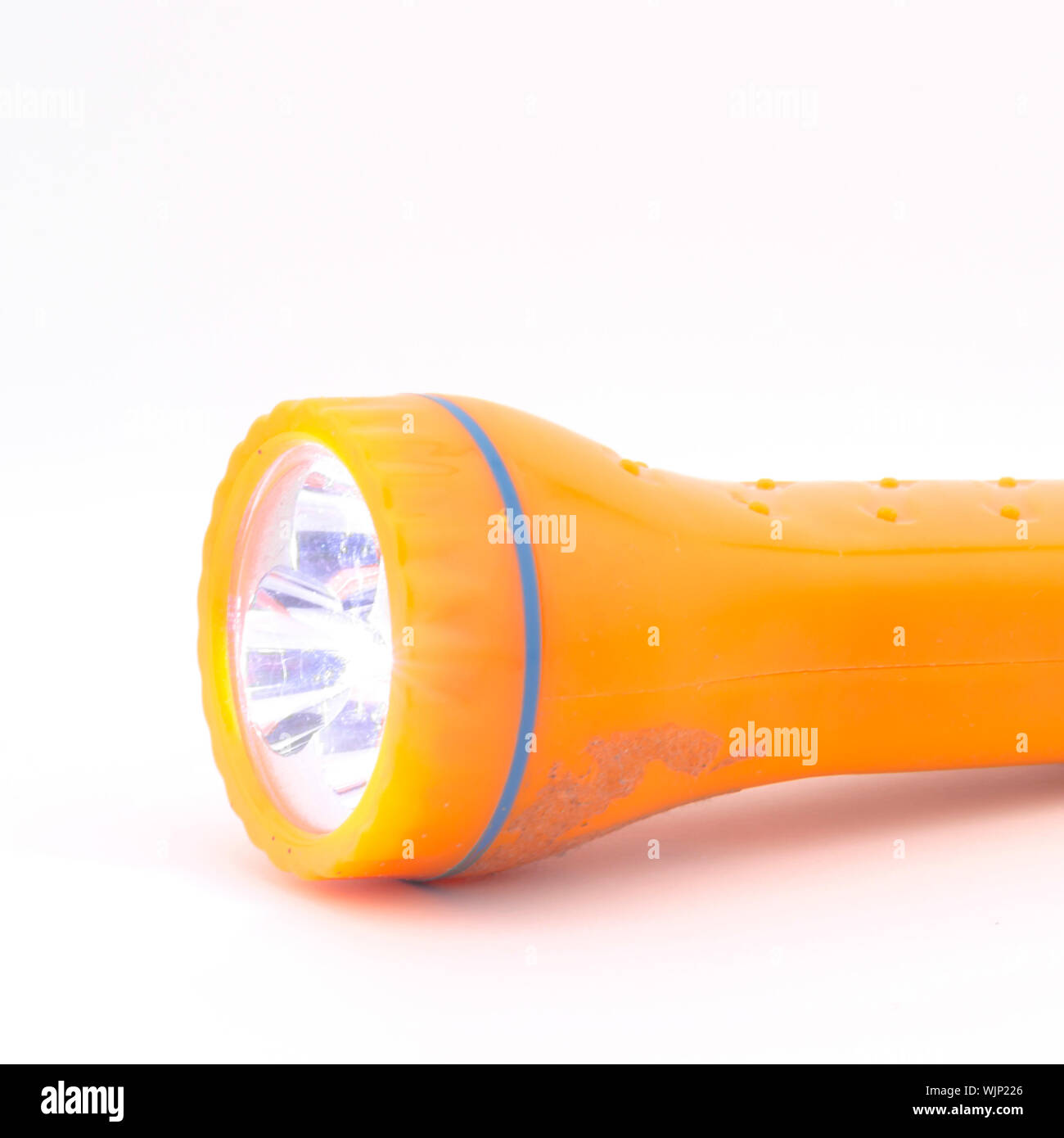 orange flashlight isolated on white background Stock Photo - Alamy