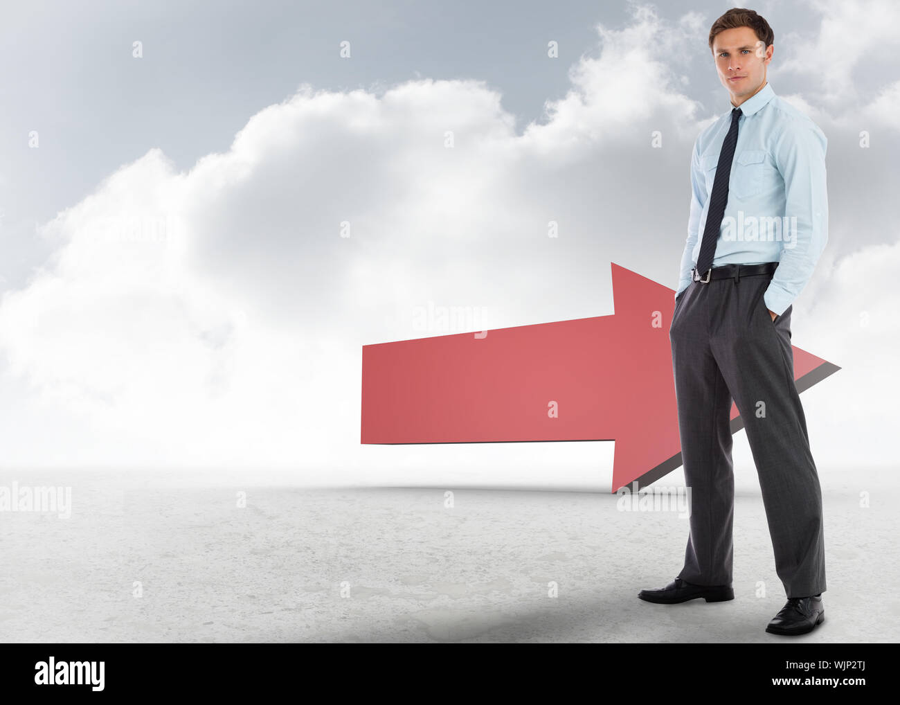 Serious businessman standing with hands in pockets against red arrow in ...