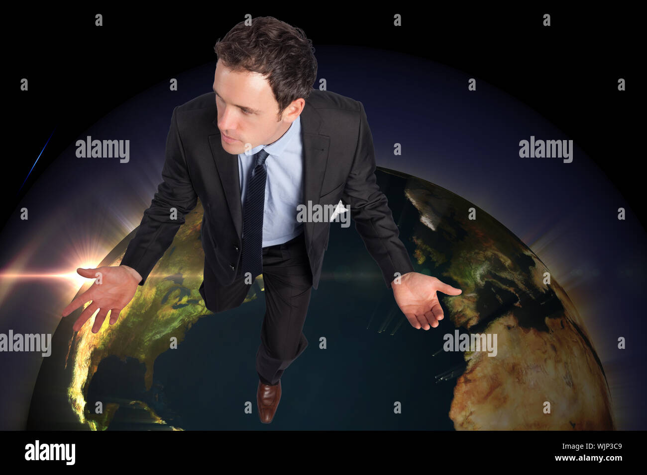 Businessman posing with arms out against holographic cityscape in ...