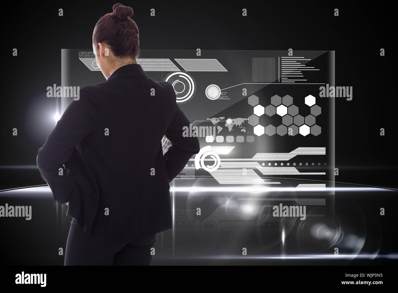 Businesswoman with hands on hips against technology interface Stock ...