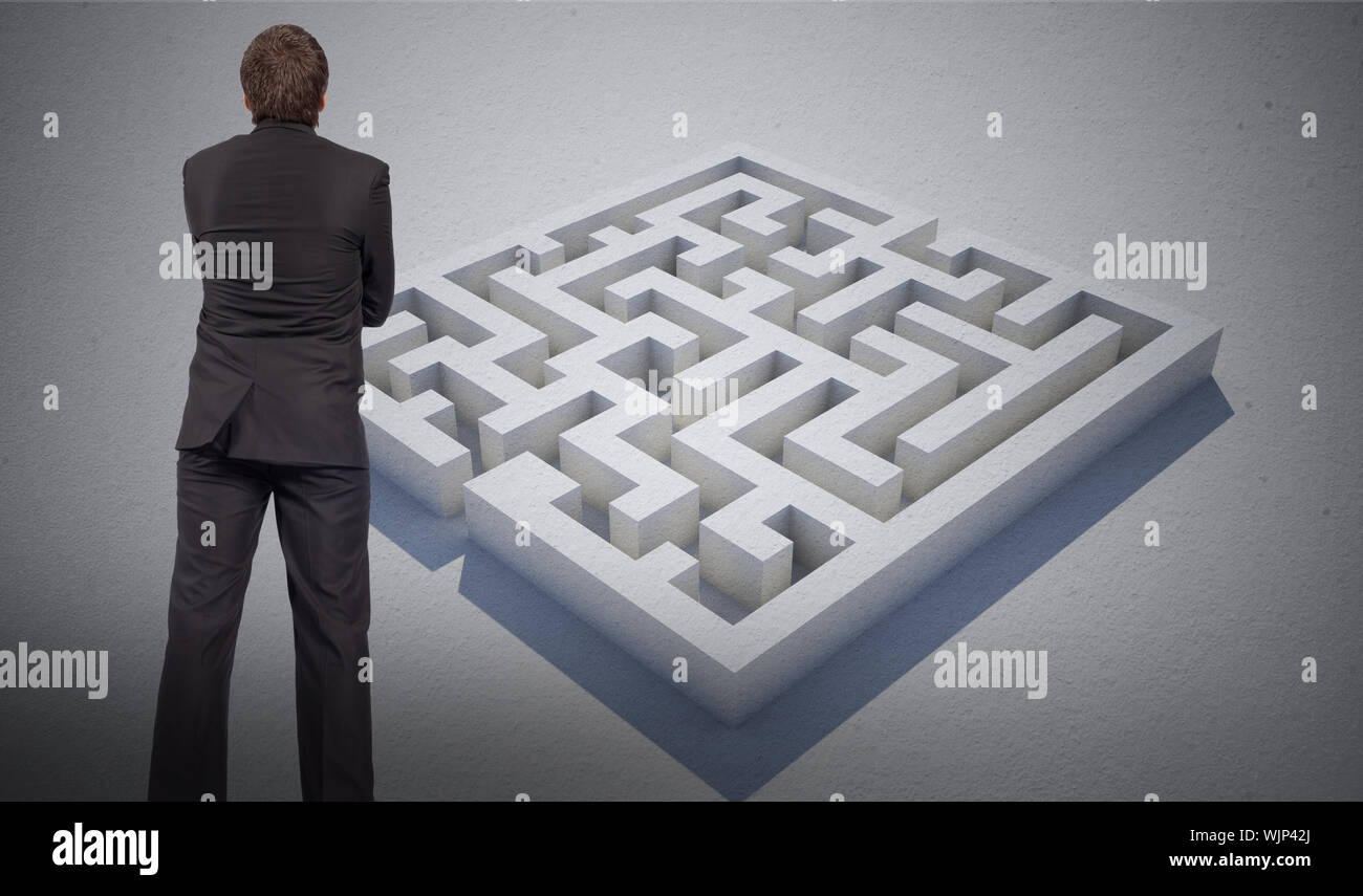 Businessman solving maze puzzle hi-res stock photography and images - Alamy