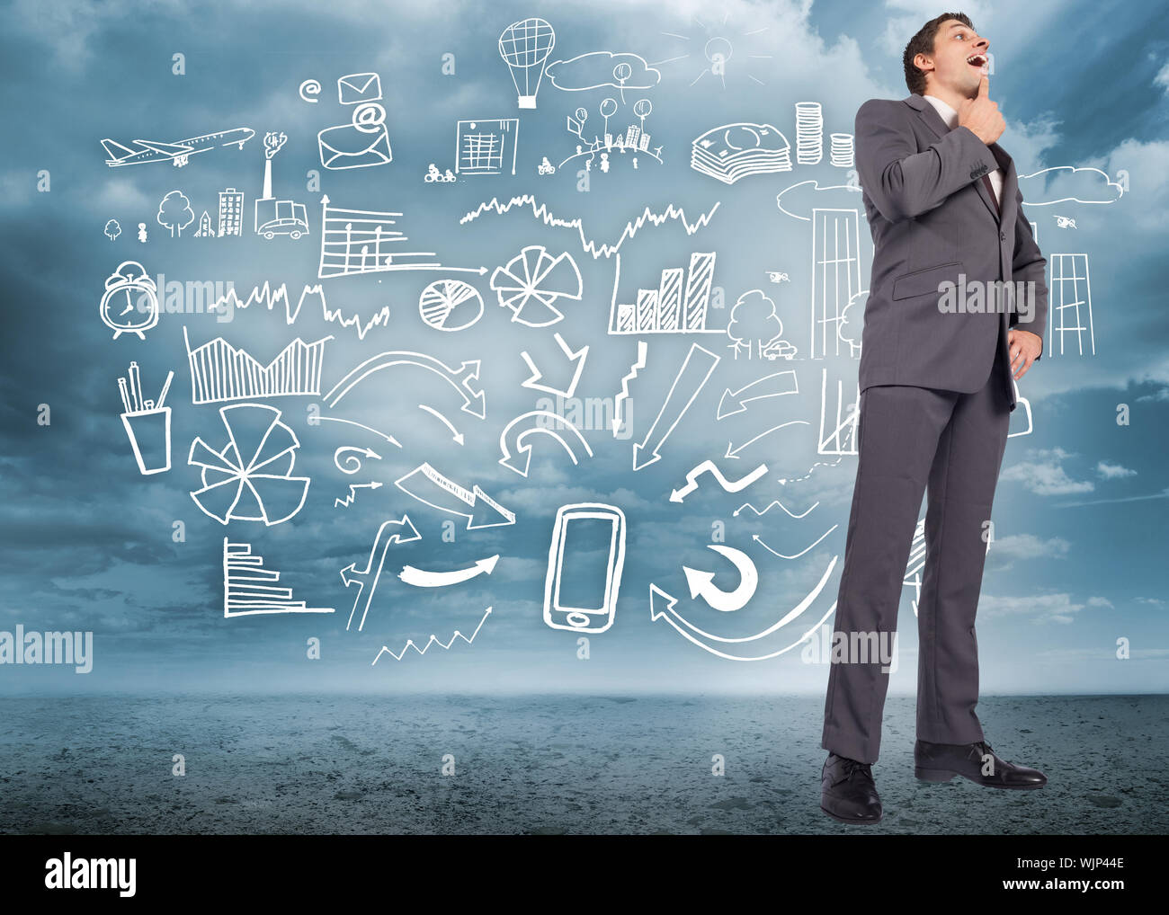 Thinking businessman touching chin against brainstorm on desert ...