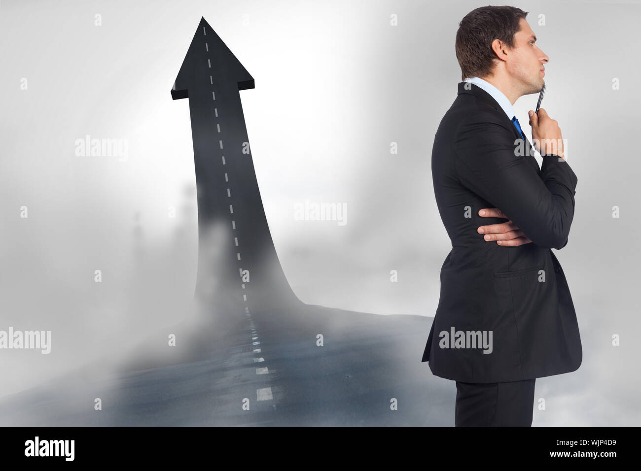 Thinking businessman holding pen against road turning into arrow Stock ...