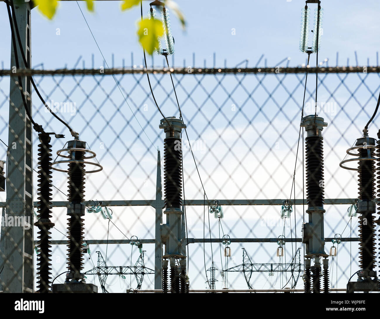 View through security fence of high voltage French power lines ...