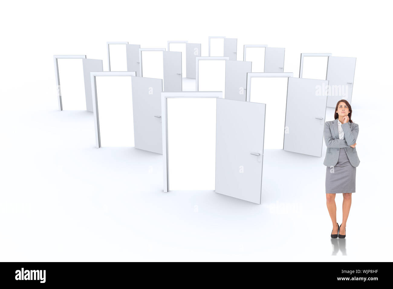 Focused businesswoman against many doors opening Stock Photo - Alamy