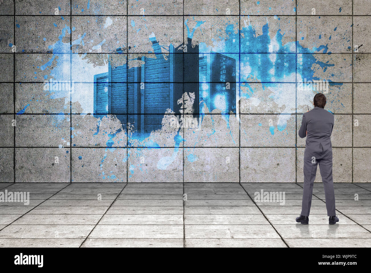 Splash on wall revealing server towers Stock Photo - Alamy