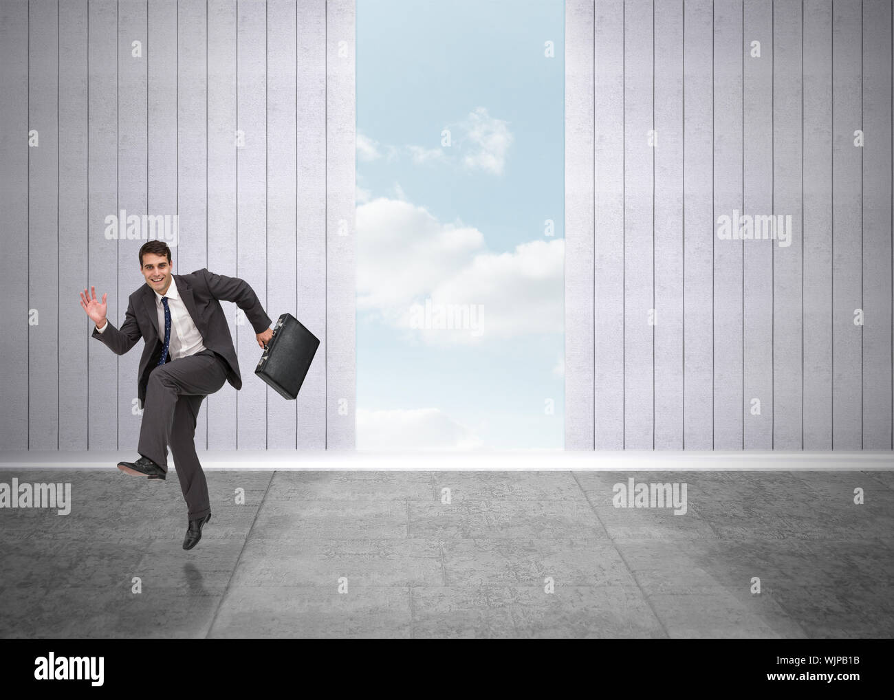 Happy businessman in a hury against door opening showing blue sky Stock ...