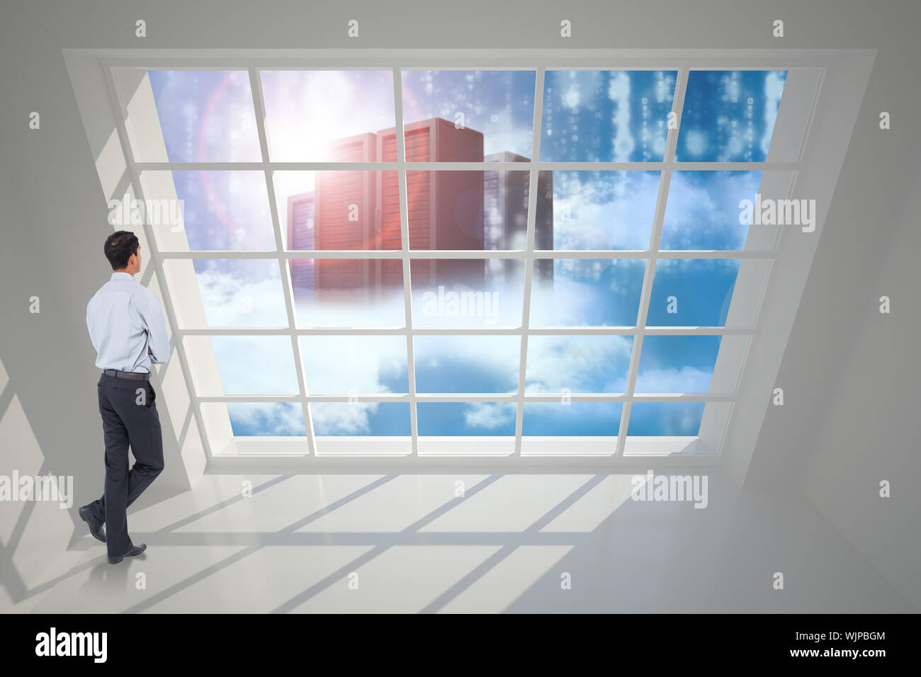 Asian businessman against server towers seen through window Stock Photo ...