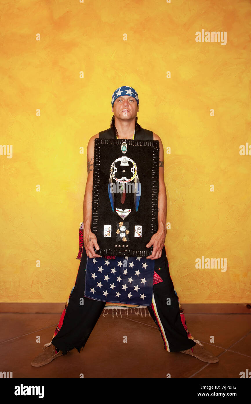 Handsome Native American man with his personal artwork Stock Photo - Alamy