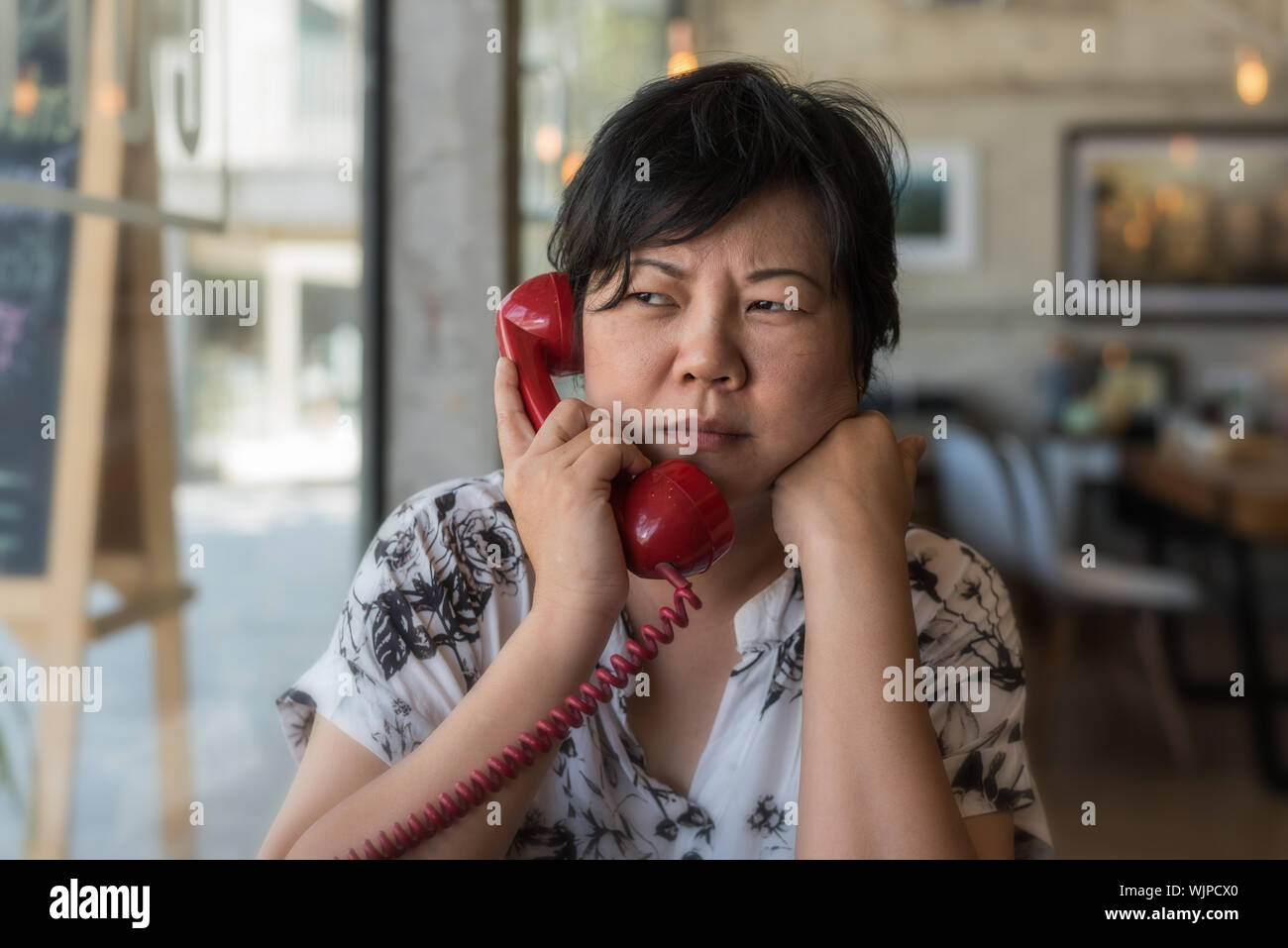 Woman telephone landline home hi-res stock photography and images - Alamy