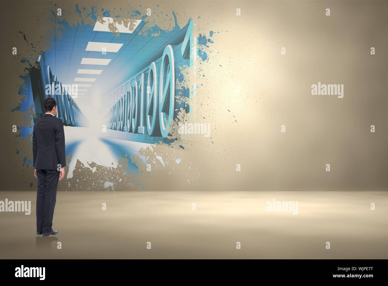 Businessman turning his back to camera against splash on wall revealing ...