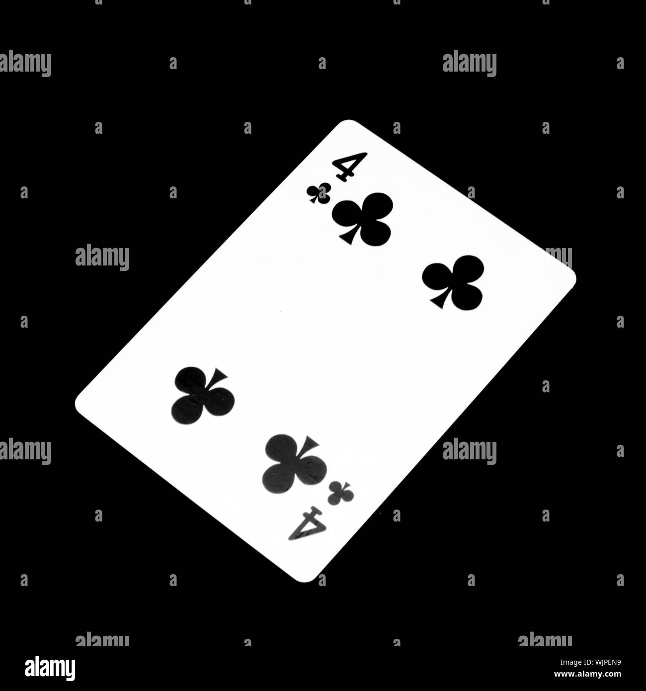 number four clover card isolated on black Stock Photo - Alamy