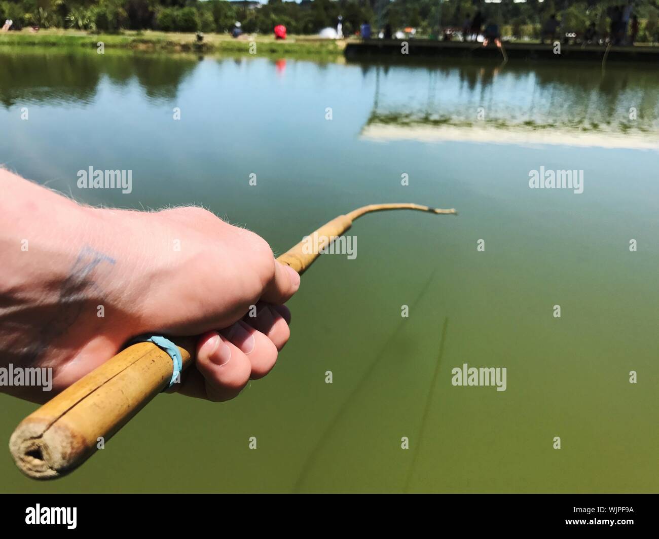 Hand fishing hi-res stock photography and images - Alamy