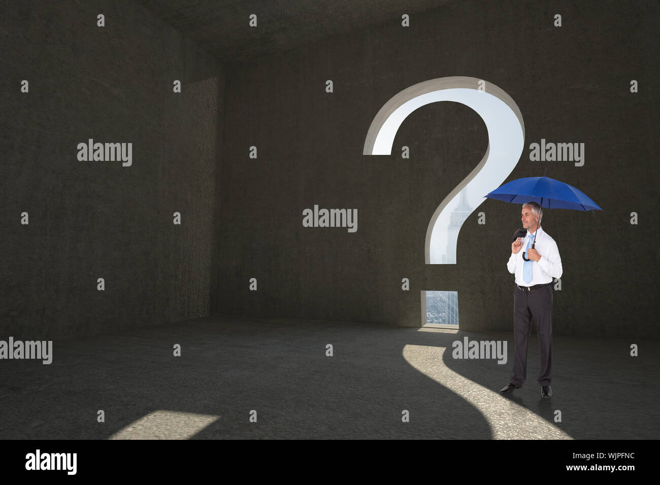 Happy businessman holding umbrella against question mark door in dark ...