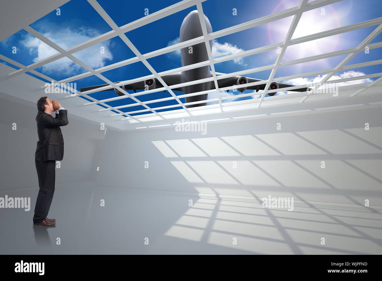 Shouting businessman against airplane flying past window in orange sky ...