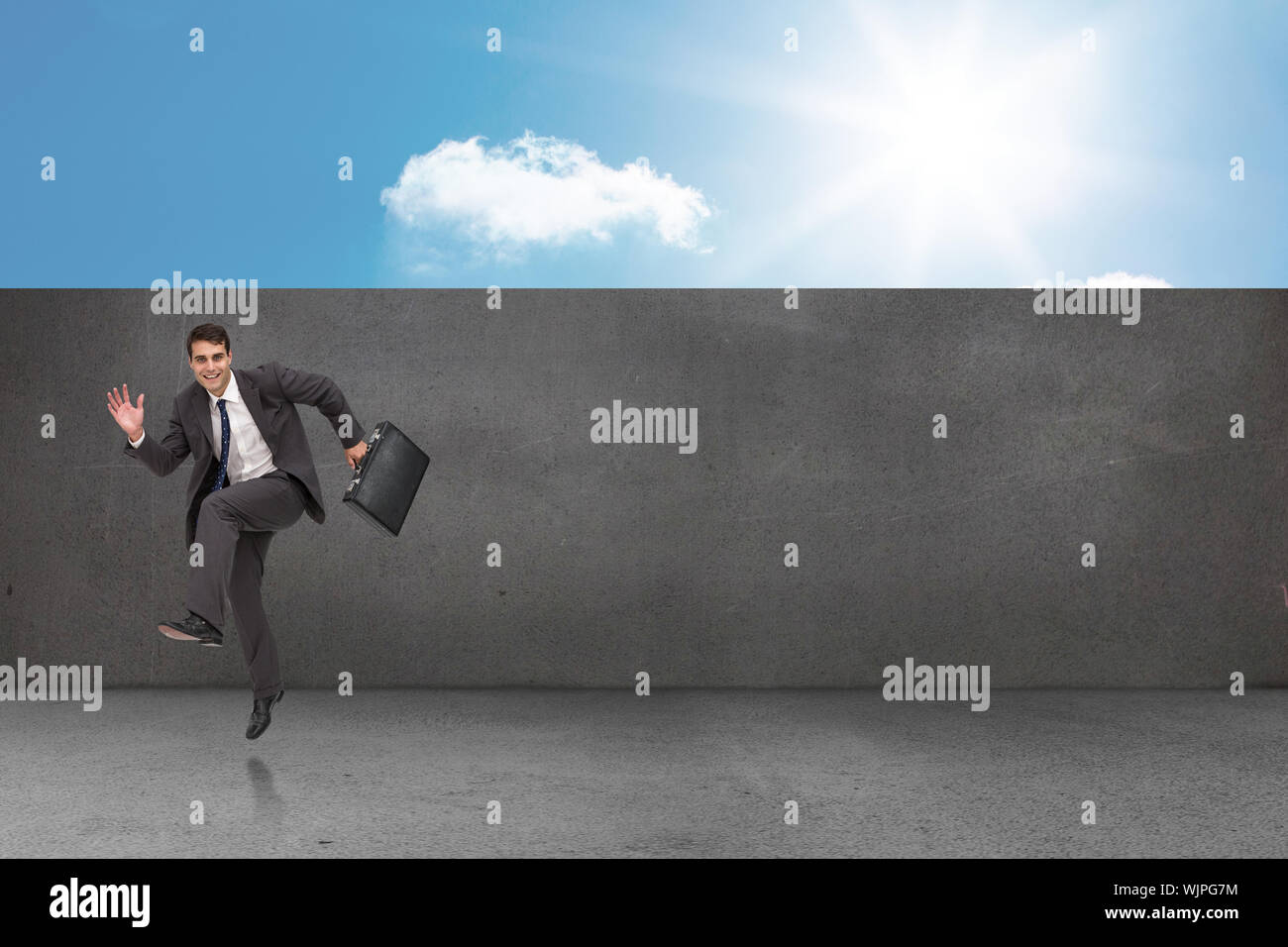 Happy businessman in a hury against door opening showing blue sky Stock ...