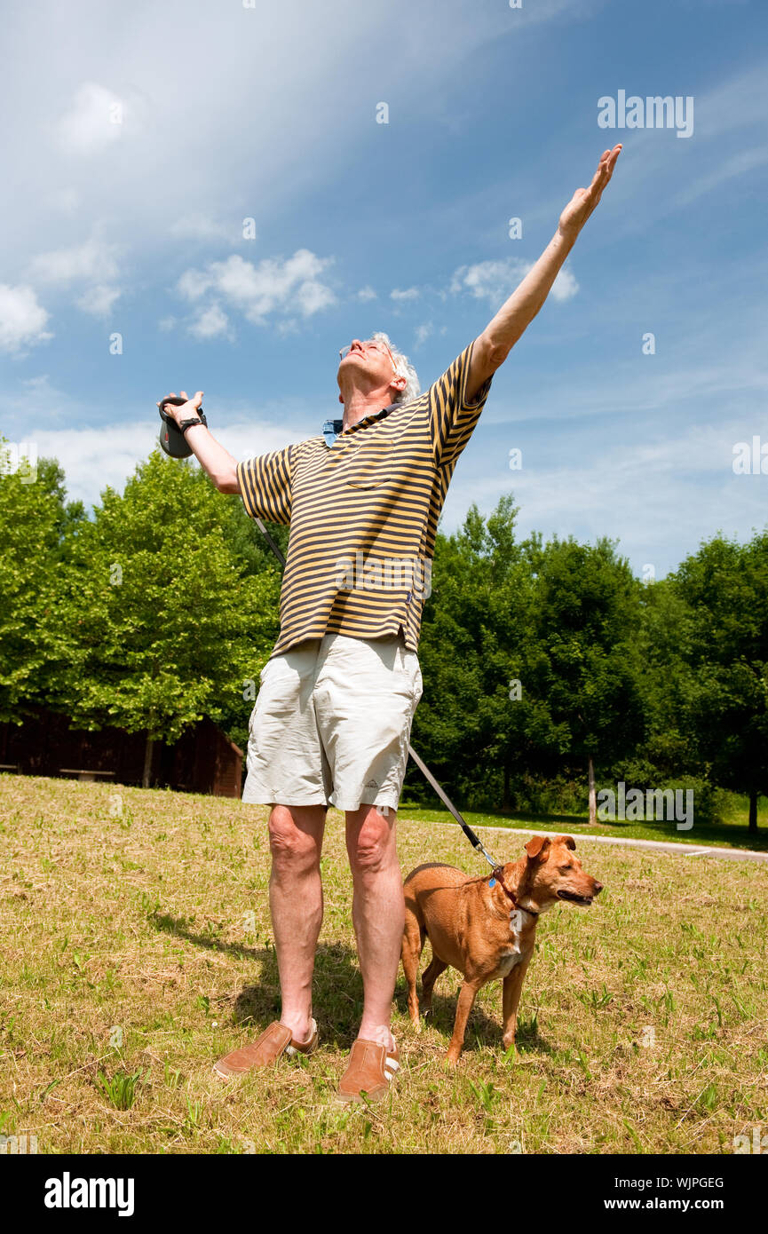 Elderly man with his cross breed dog outdoor hi-res stock photography ...