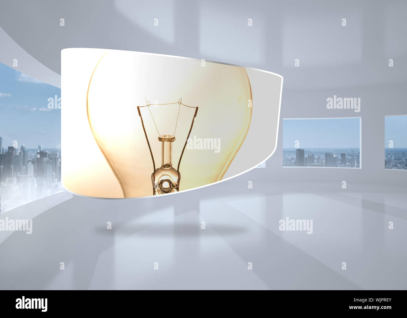 Lightbulb on abstract screen against bright white room with windows ...