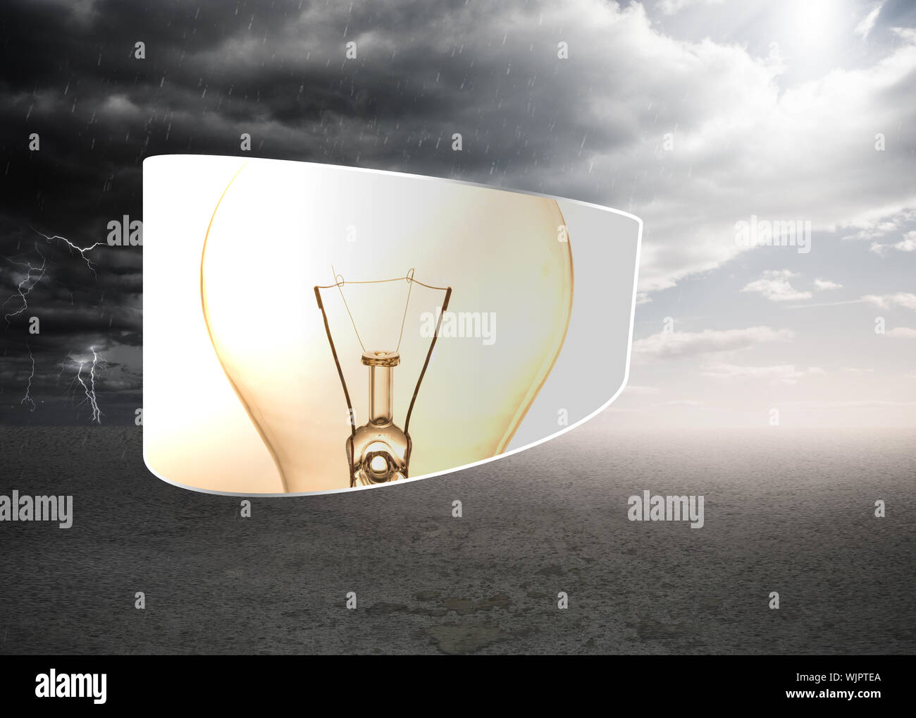 Lightbulb on abstract screen against bright white room with windows ...
