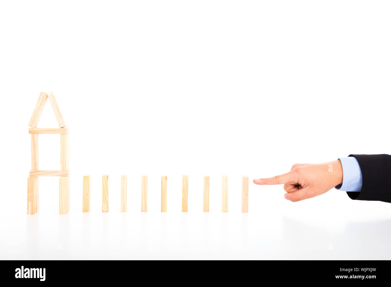 business person ready to push dominoes in a row Stock Photo - Alamy