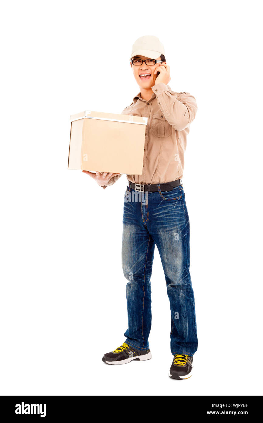 delivery man talking with cell phone and holding parcel Stock Photo - Alamy