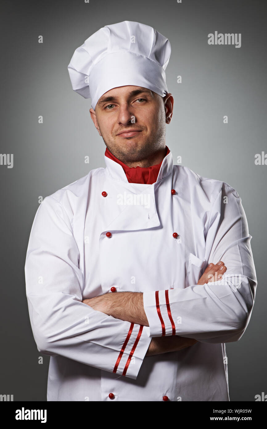 Male chef portrait against grey background Stock Photo - Alamy