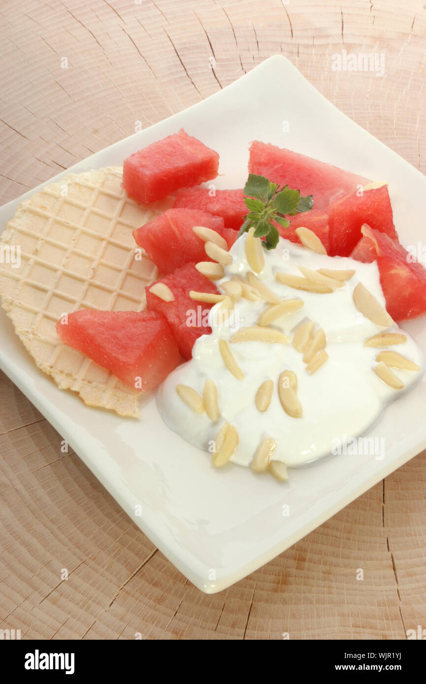 melon with cream fresh and almond slivers Stock Photo - Alamy
