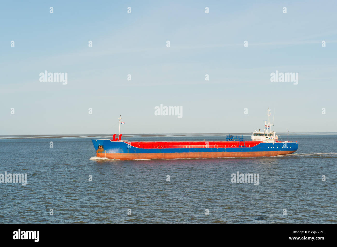Blue and red tanker ship at the Dutch Nordsea Stock Photo - Alamy
