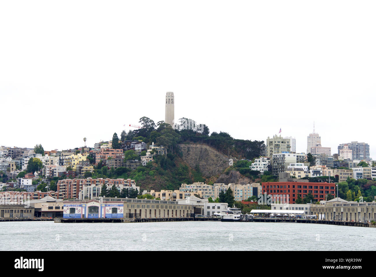 Coit Tower in San Francisco, viewed from the bay. Coit Tower is a 210 ...