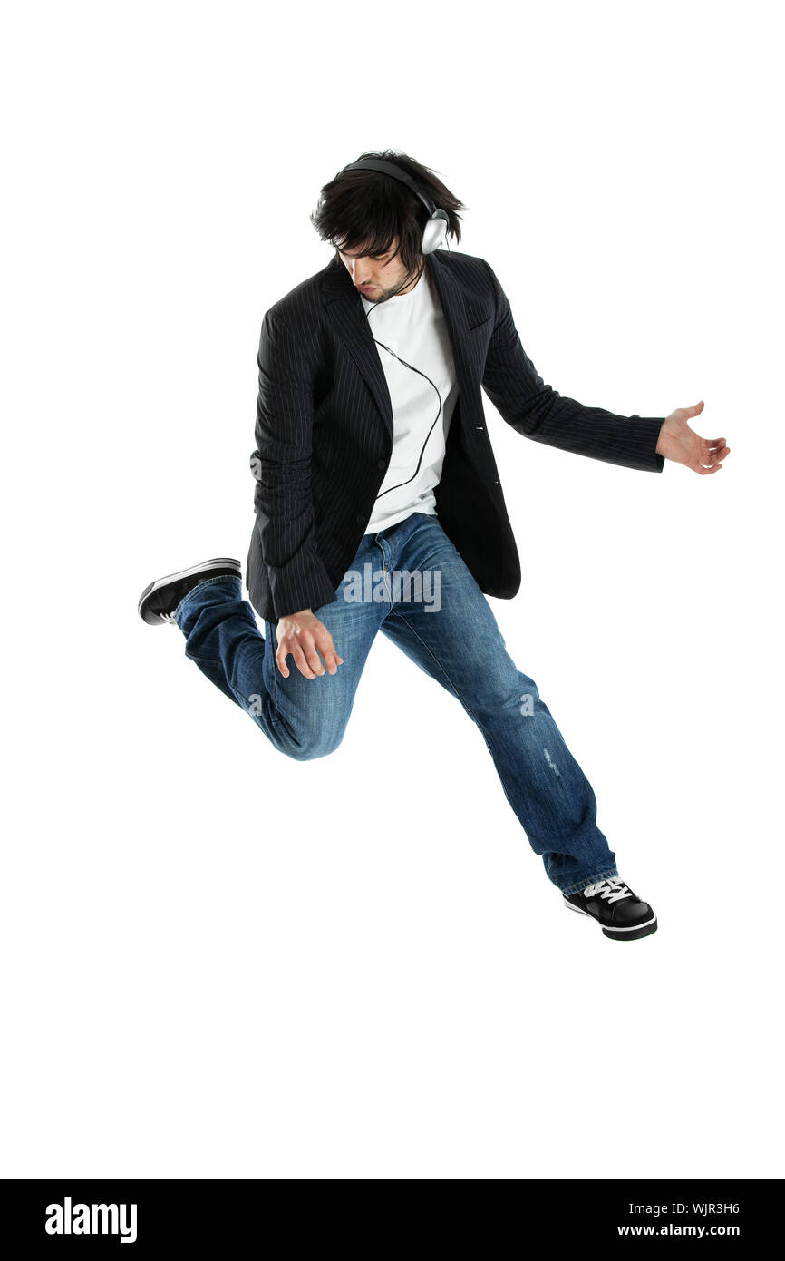Young modern man jumping over a white background Stock Photo - Alamy