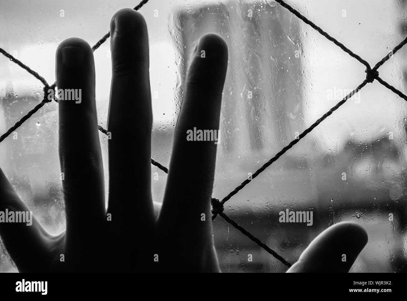 Rainy window hand hi-res stock photography and images - Alamy