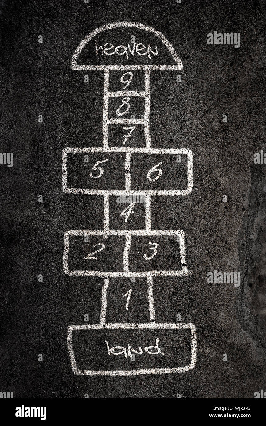 Hopscotch game designed on the road with chalk Stock Photo - Alamy