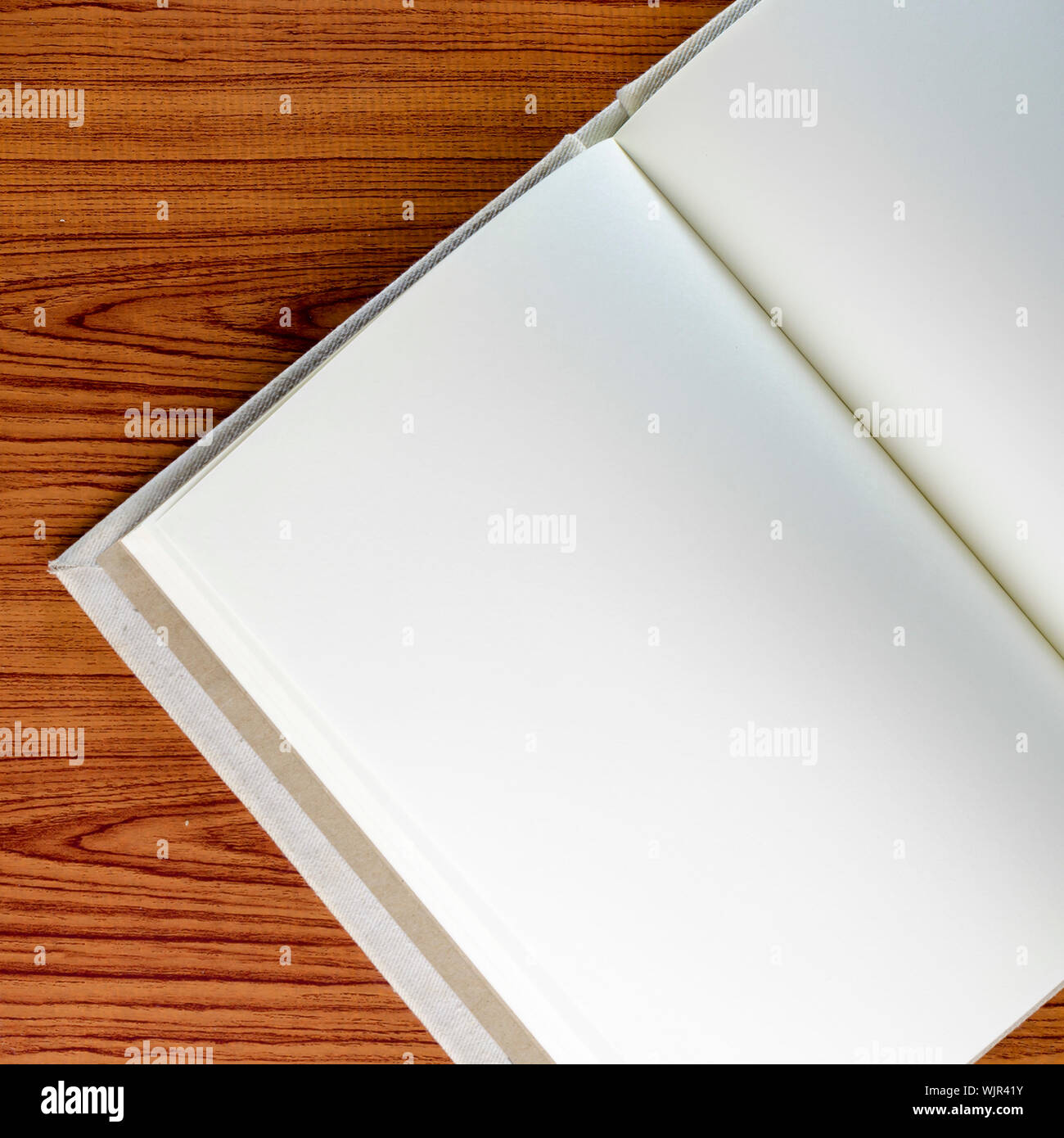 notebook on wood background Stock Photo - Alamy